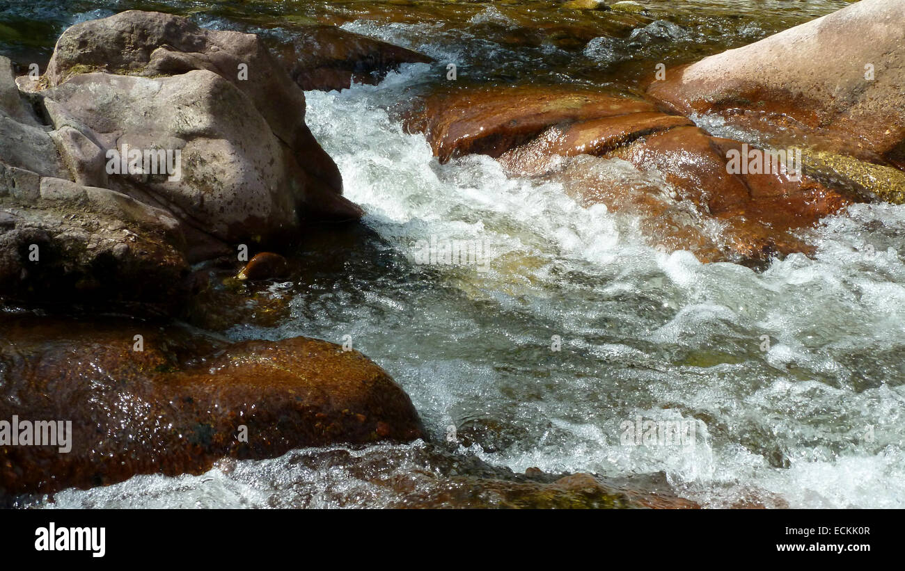 Water flowing through rocks Stock Photo - Alamy