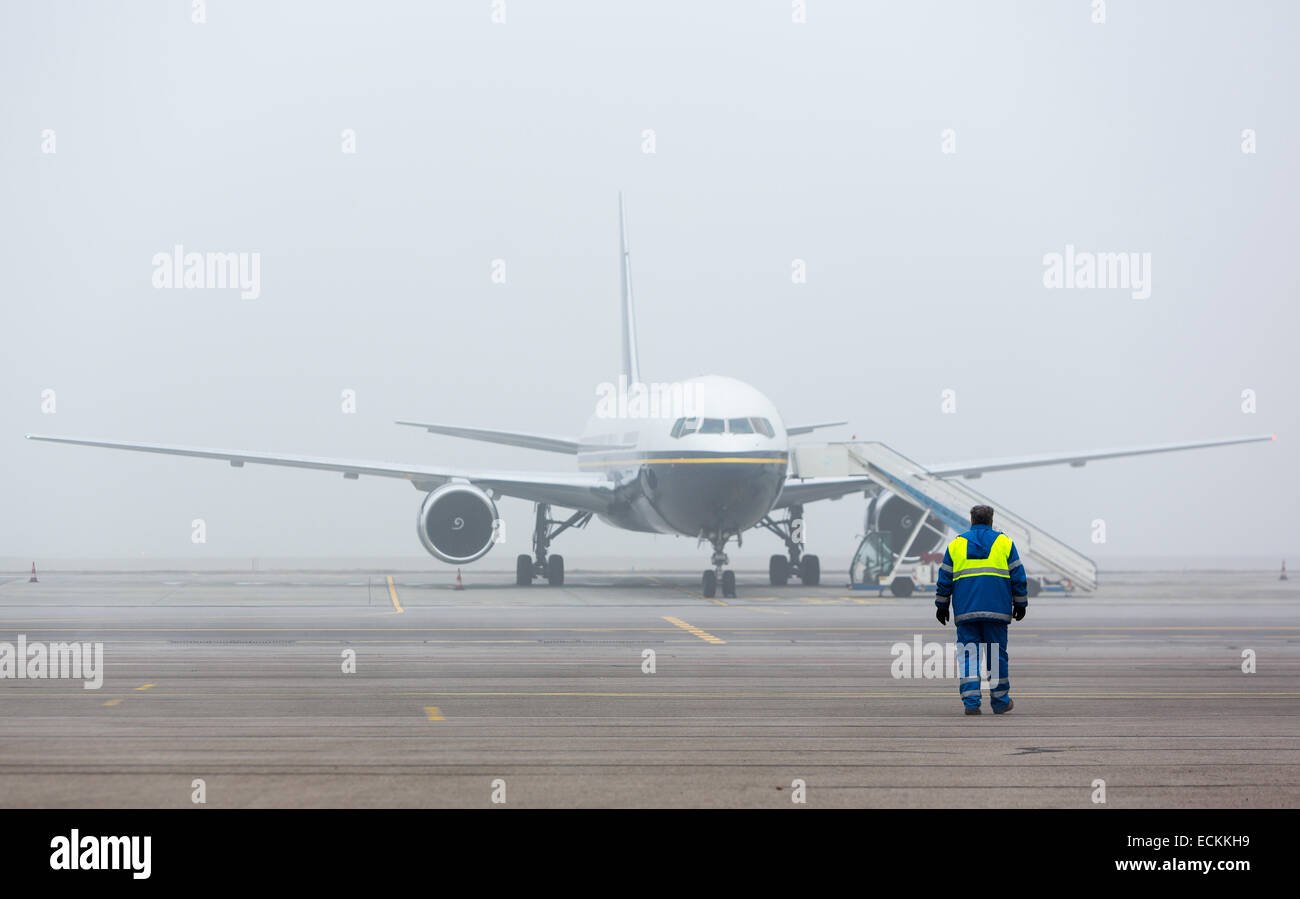 Airplane on an airport landing strip hi-res stock photography and ...