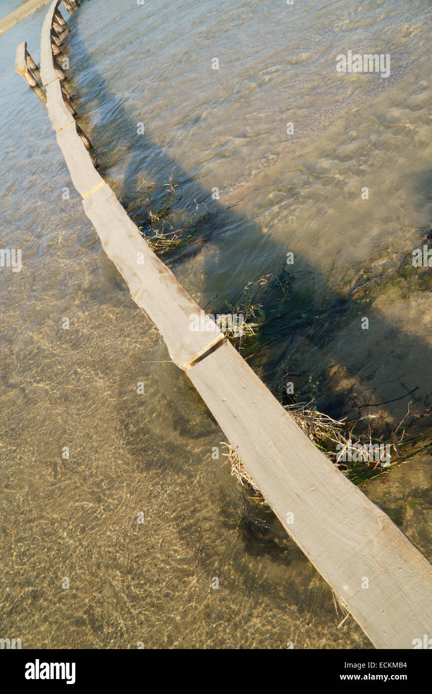single lane log bridge over a shallow river in Museom Village, Yeongju ...