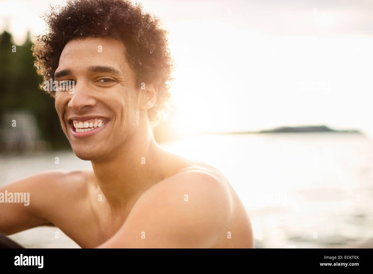 Young man sitting hi-res stock photography and images - Alamy