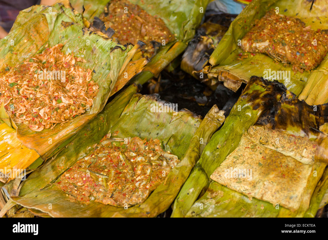 Cooked fish dish for sale, wrapped in banana leaves, Warorot Market ...