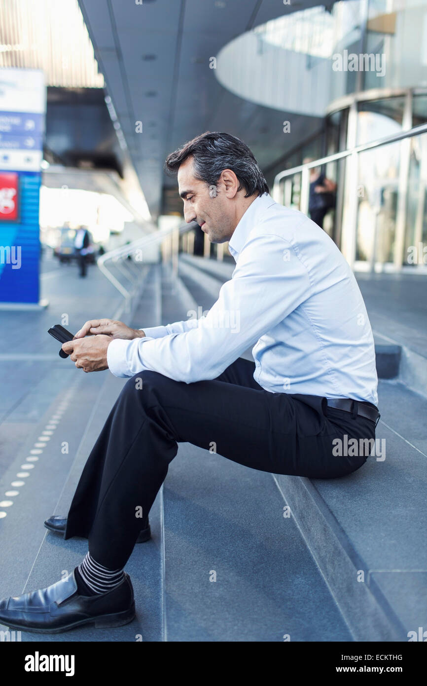 Mature men sitting side side steps hi-res stock photography and images ...