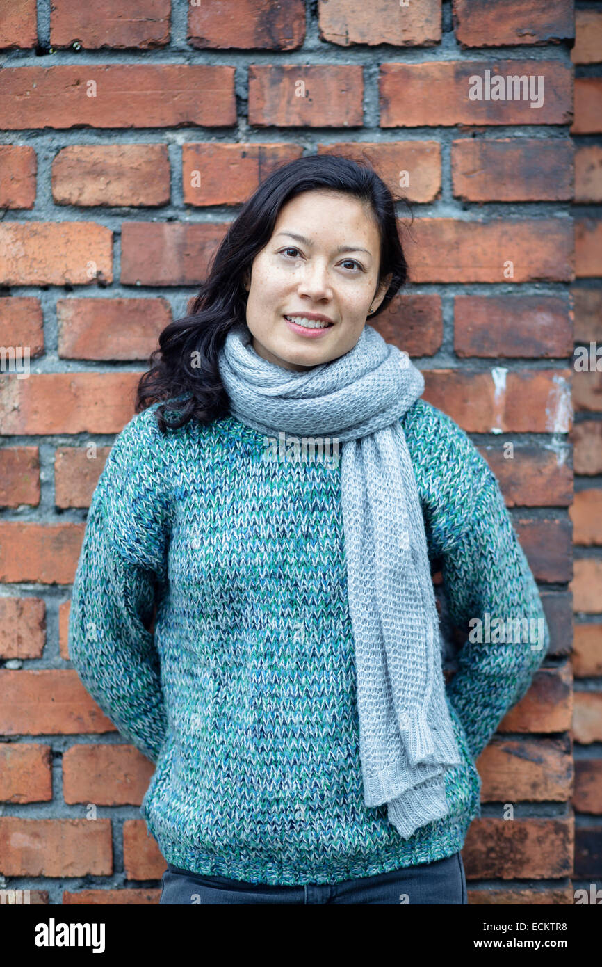 Woman Standing Against Brick Wall High Resolution Stock Photography and ...