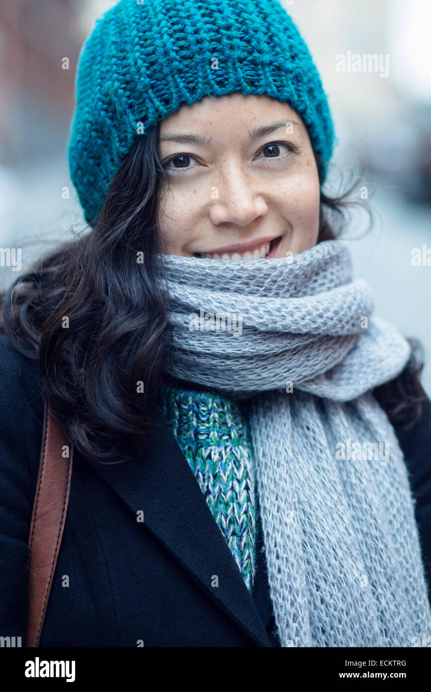 Portrait of smiling woman standing on city street Stock Photo - Alamy