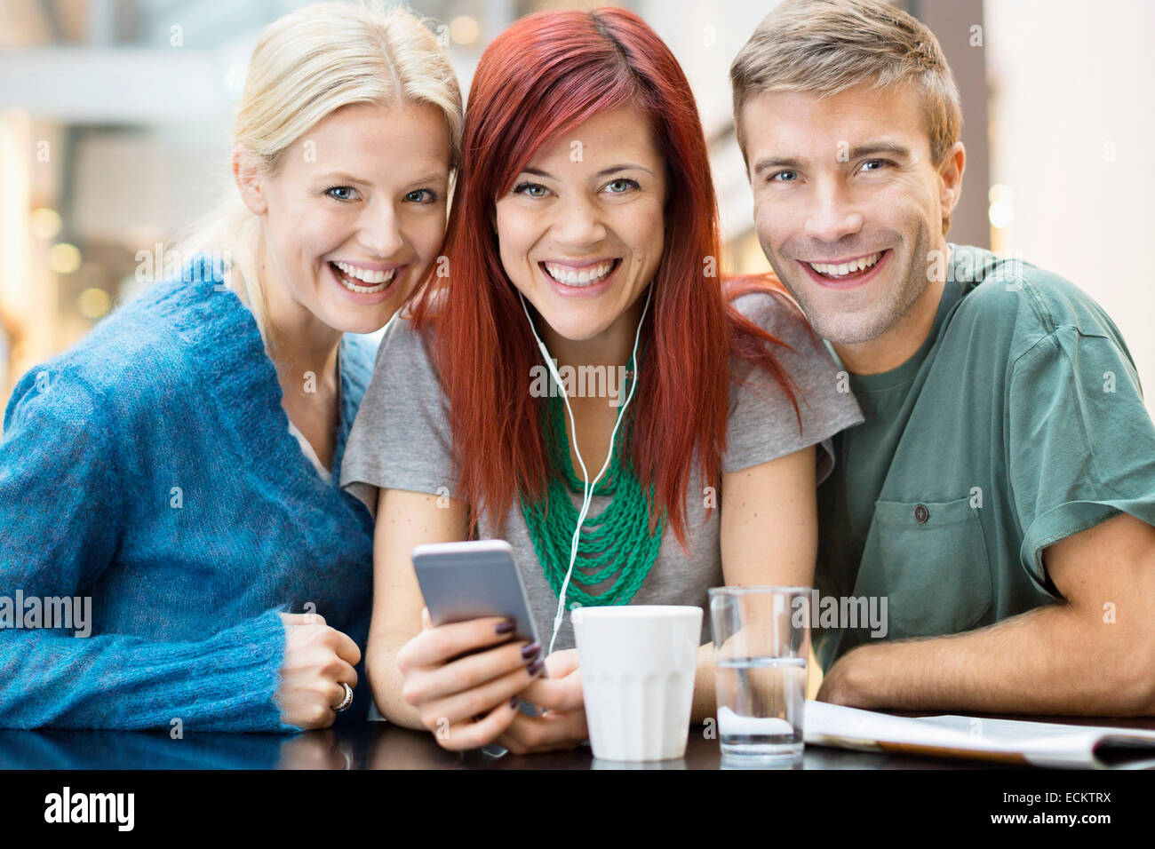 Portrait of happy friends in restaurant Stock Photo - Alamy