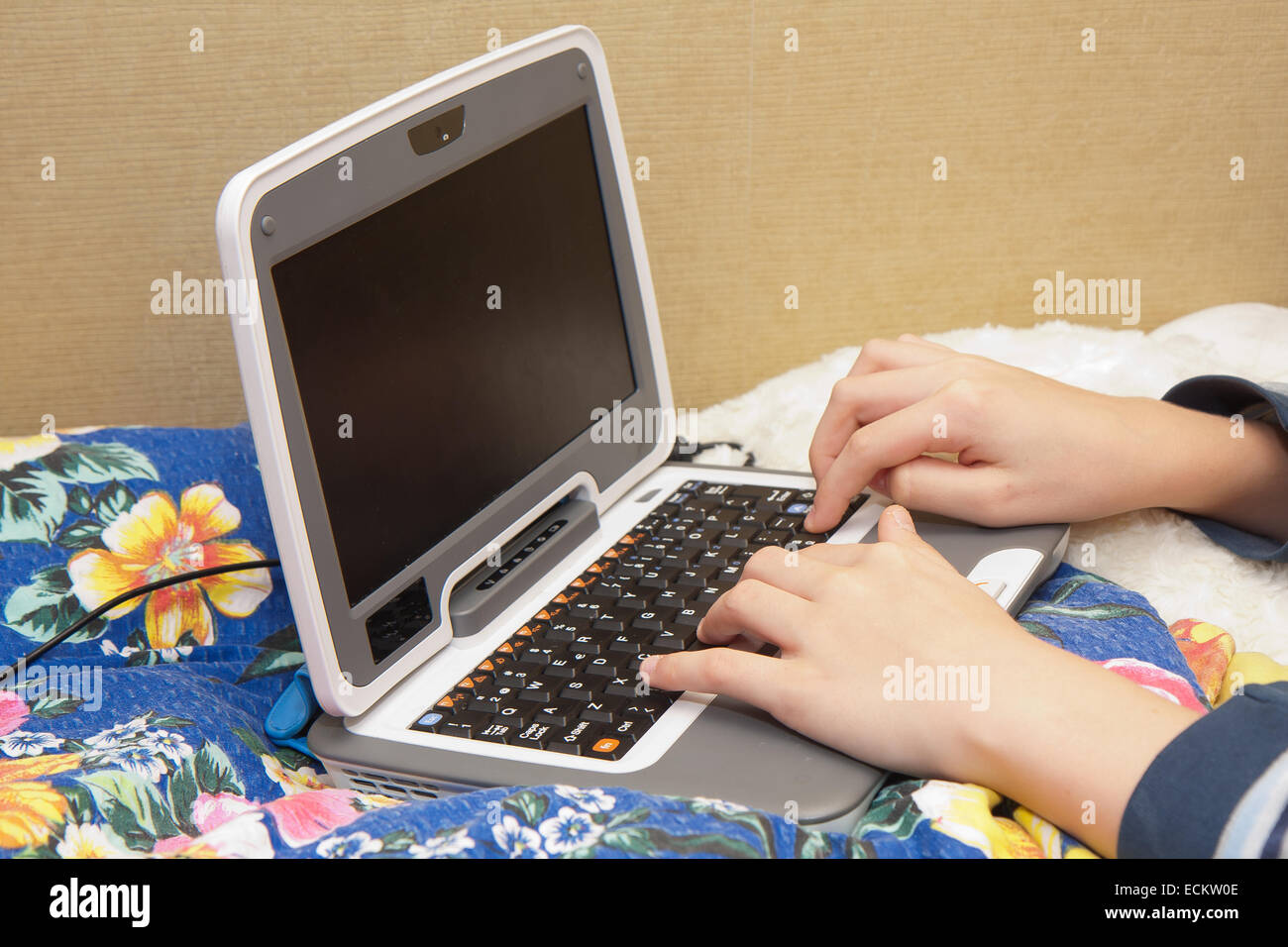 Boy with laptop in bed hi-res stock photography and images - Alamy
