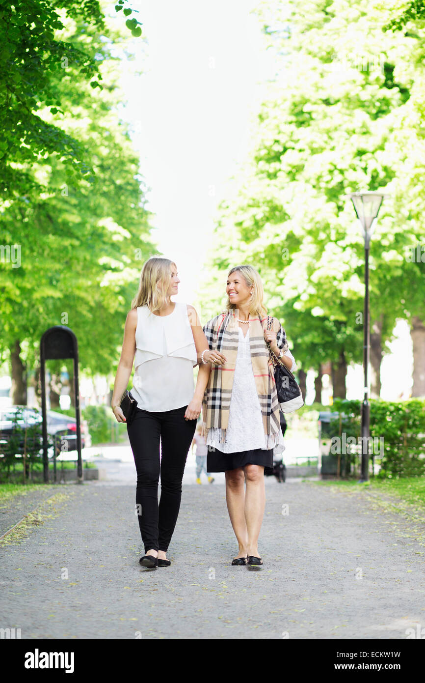 Two friends walking in garden hi-res stock photography and images - Alamy