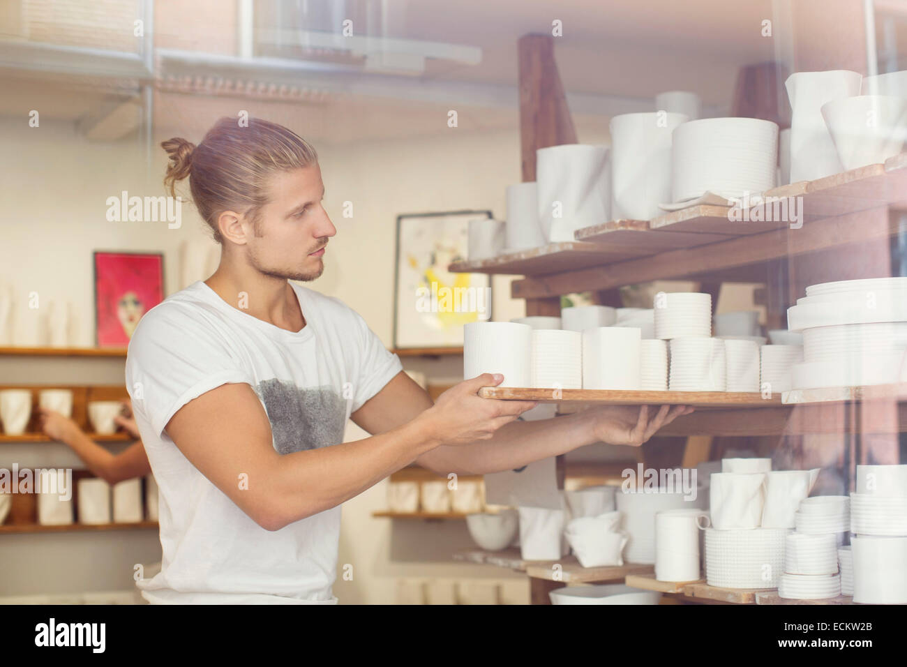 Young male shop worker hi-res stock photography and images - Alamy