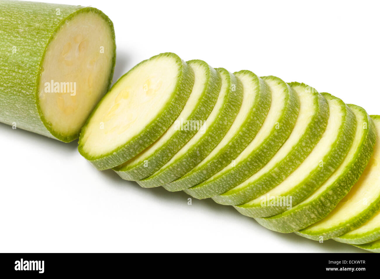 Fresh sliced zucchini isolated on white background Stock Photo - Alamy