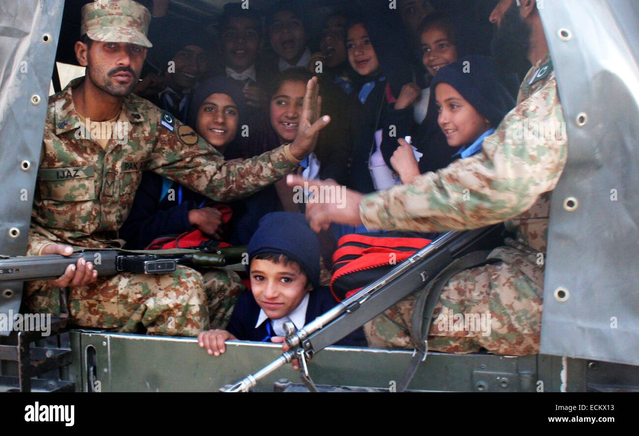 Peshawar. 16th Dec, 2014. Pakistani soldiers transport rescued school ...