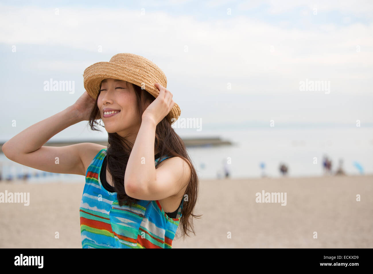 A woman on a beach in Kobe Stock Photo - Alamy