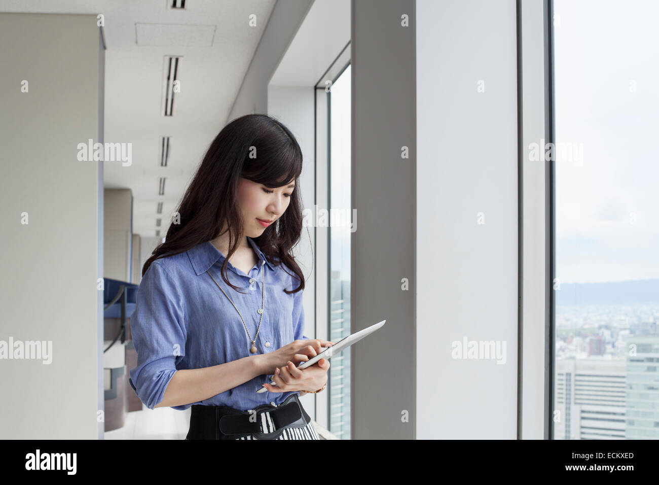 A working woman in an office building Stock Photo - Alamy