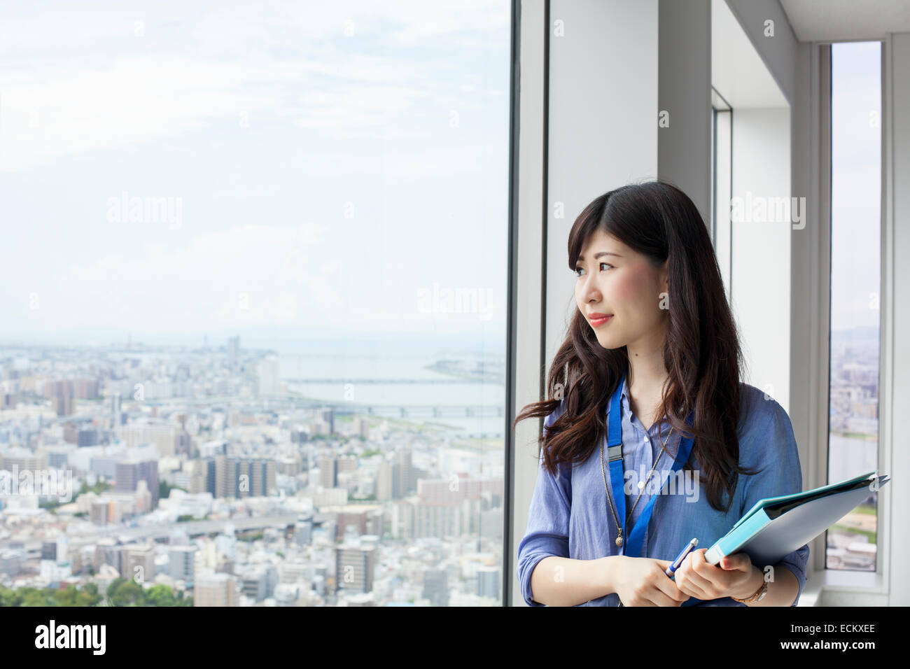 A working woman in an office building Stock Photo - Alamy