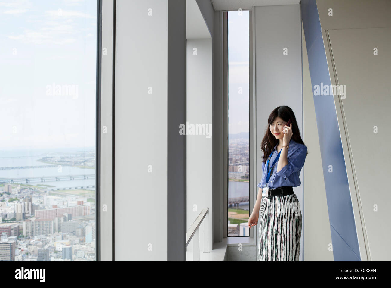 Professional looking business woman in front of office building hi-res ...
