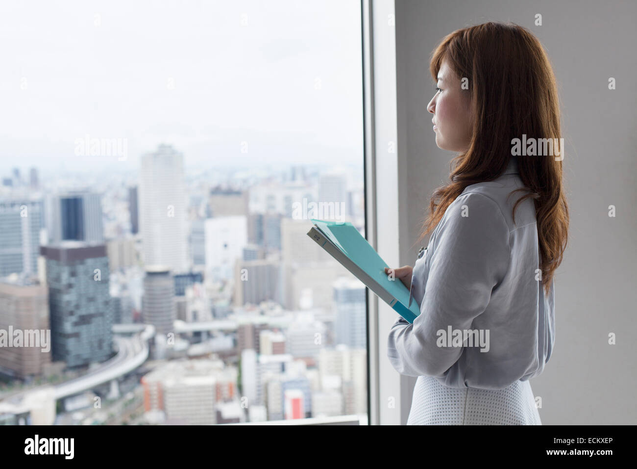 A working woman in an office building Stock Photo - Alamy