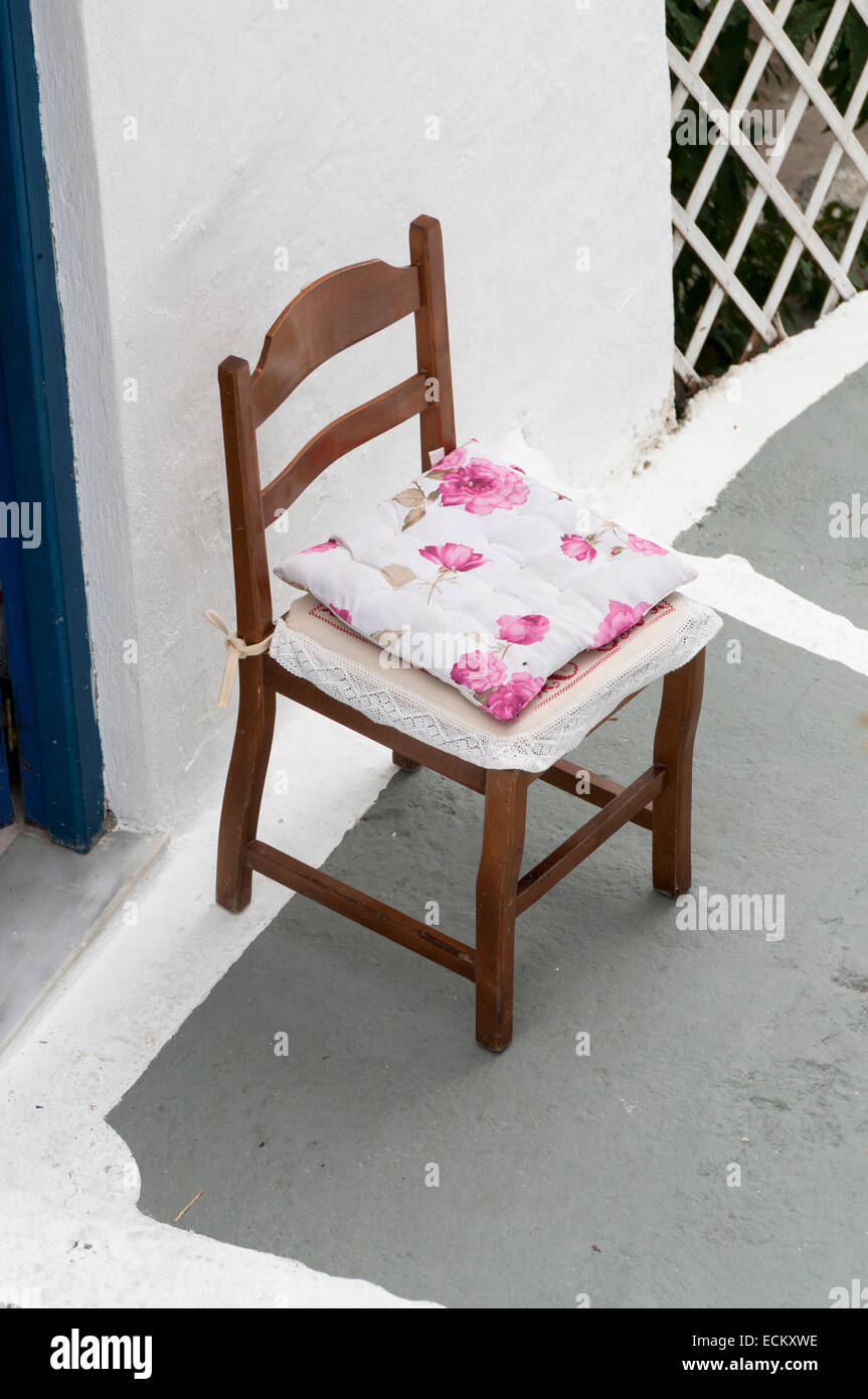 traditional Greek wooden chair with decorated pillow Stock Photo - Alamy