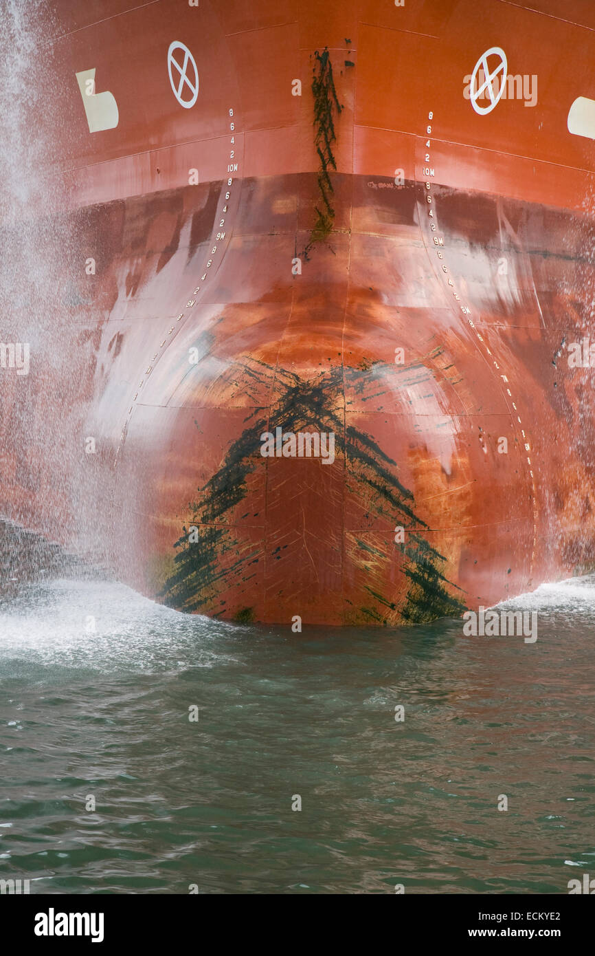 Bulbous bow on a red tanker cleaning anchors Stock Photo - Alamy
