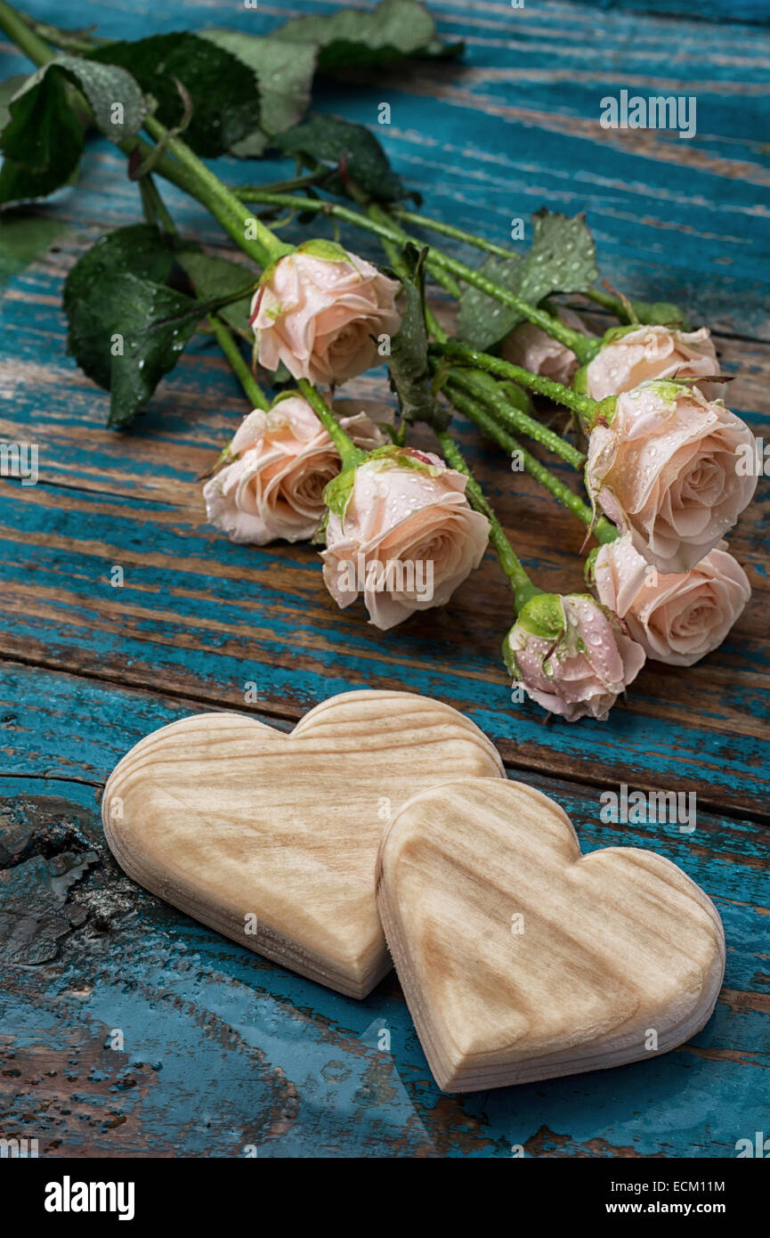 two wooden heart and bouquet of fresh cut roses Stock Photo - Alamy