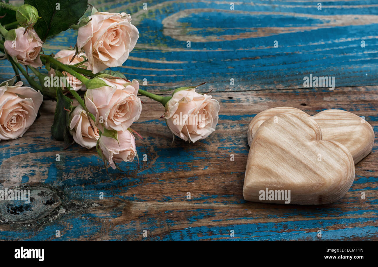 two wooden heart and bouquet of fresh cut roses Stock Photo - Alamy