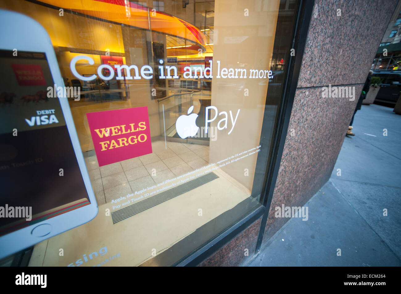 Signage on a window in a Well Fargo bank in New York informs customers ...