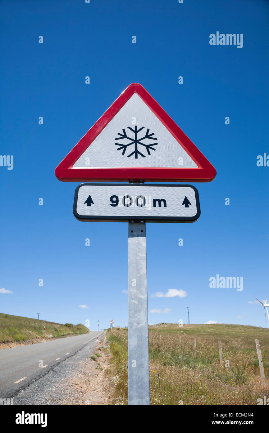 metal pole with traffic signal advice danger snow at 900 metres in ...