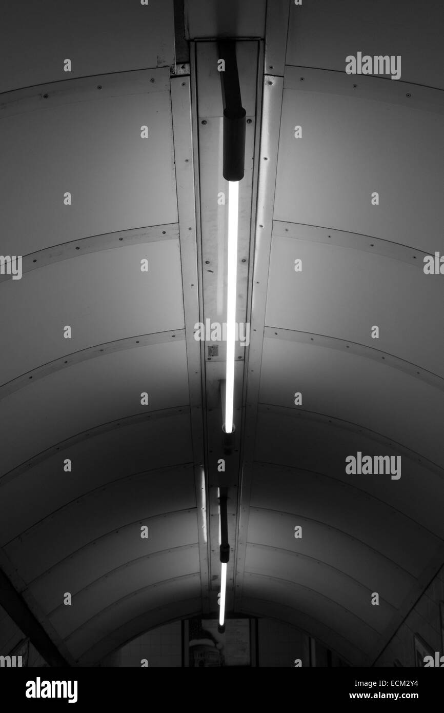 Black and white photograph of the ceiling in London underground stair ...