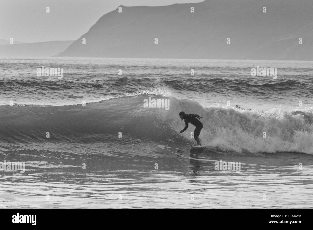 High winds fill the air with spray bringing good waves for surfers ...