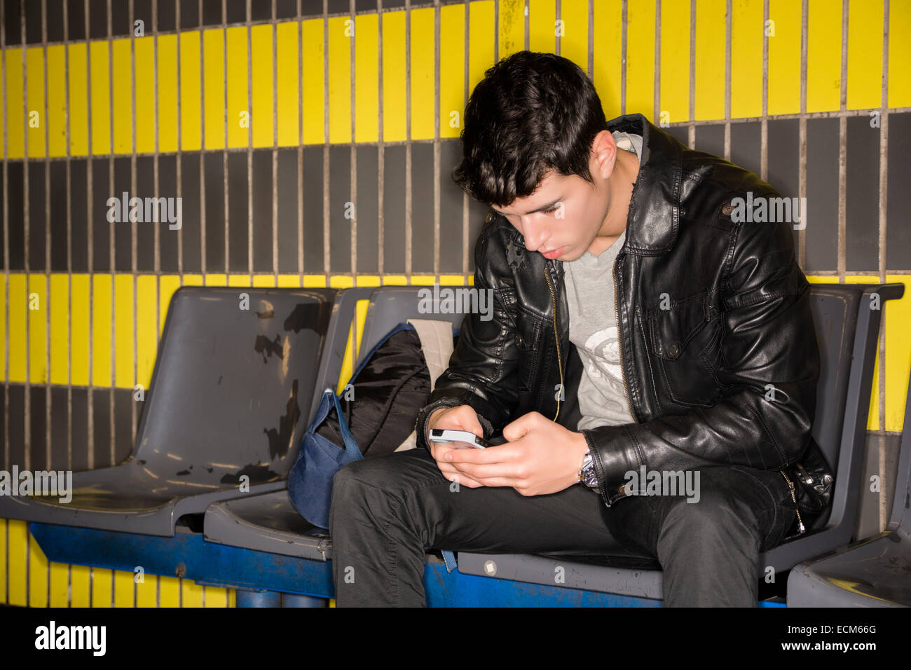 One businessman on the phone on the subway platform hi-res stock ...