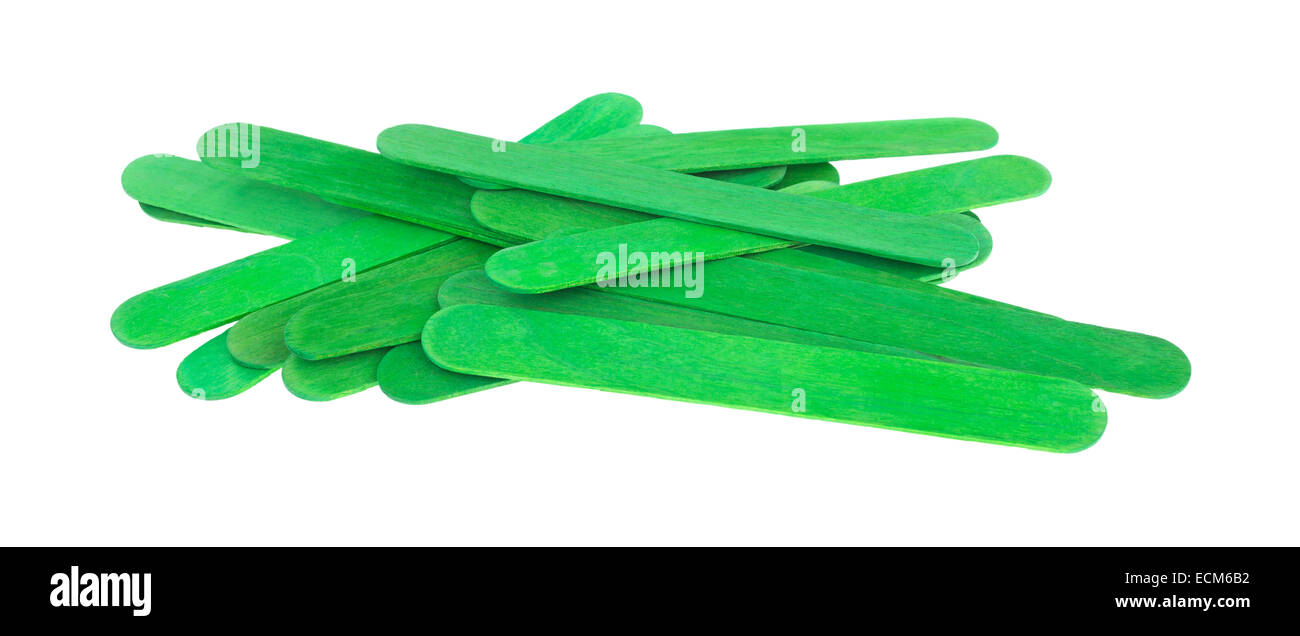 A group of dyed green holiday craft sticks on a white background Stock ...