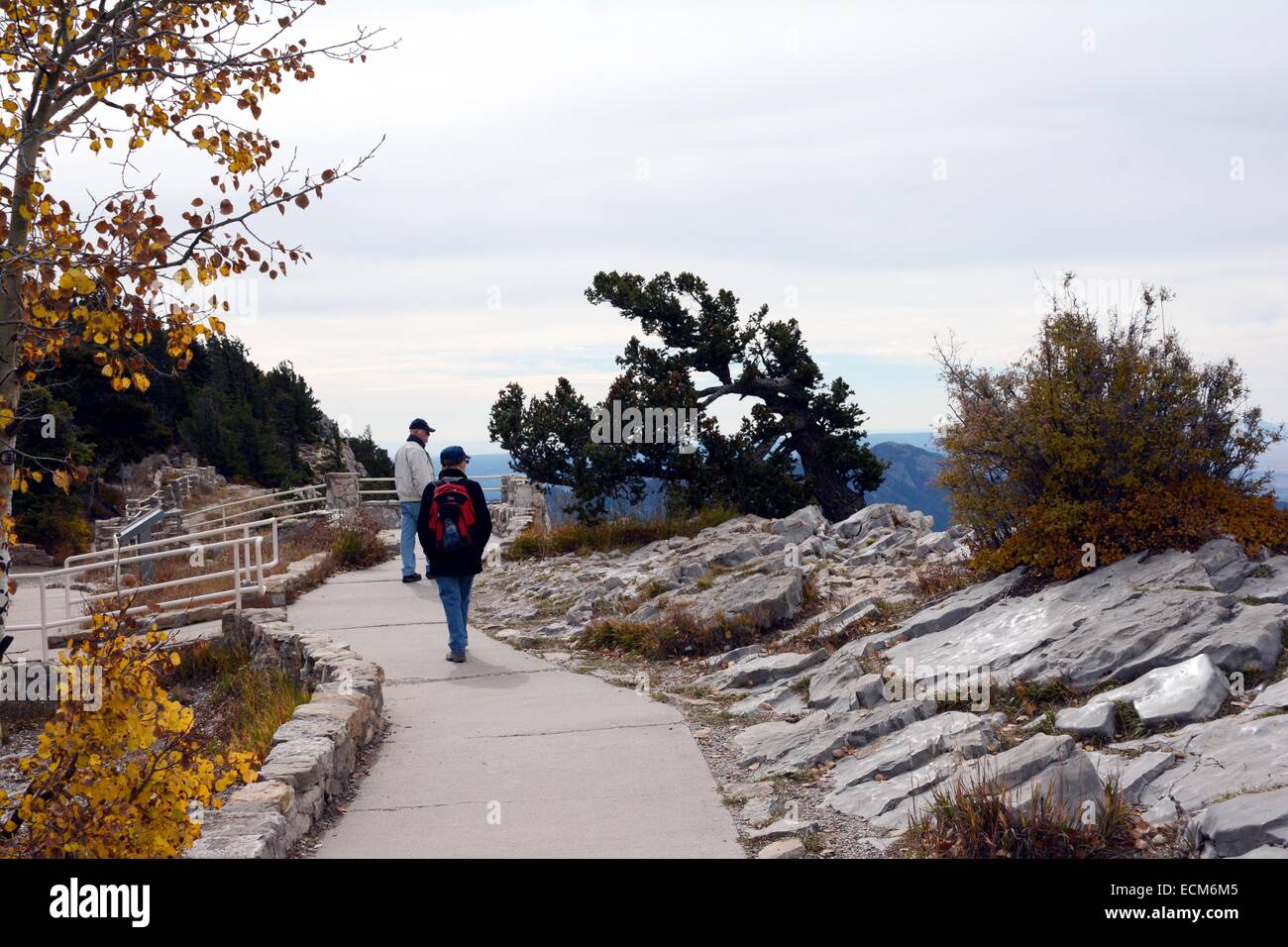 Two senior citizens on a hike in the Sandia mountains near Albuquerque ...