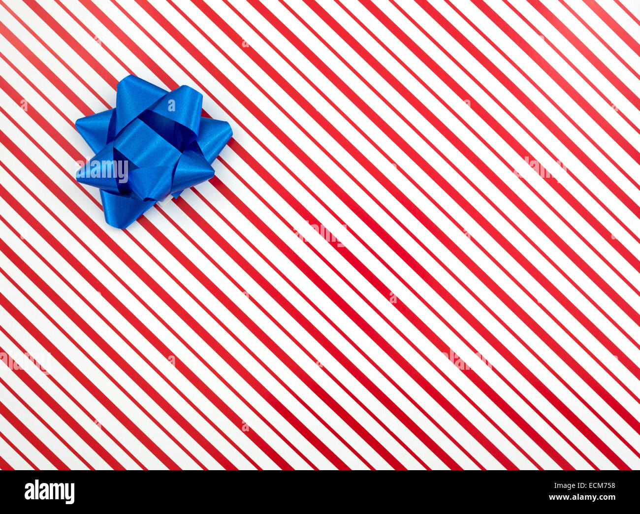 Top view of a Christmas red and white striped box with a blue bow Stock ...