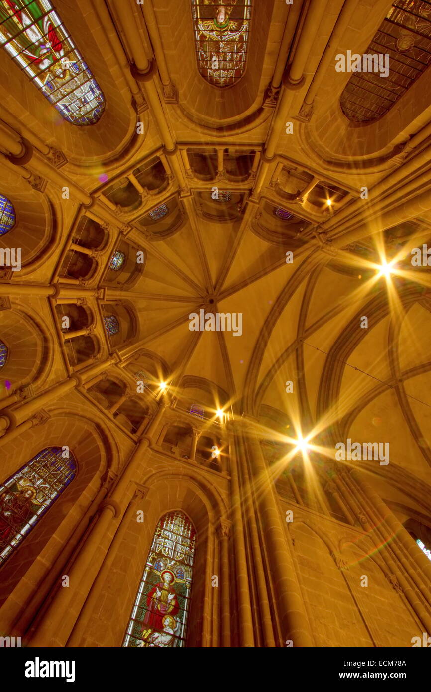 Dome and stained glass windows inside Saint-Pierre cathedral at choir ...