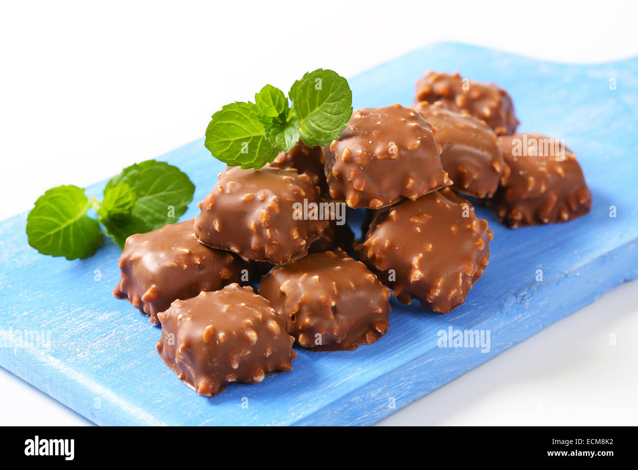 Chocolate pralines with chopped nuts Stock Photo - Alamy