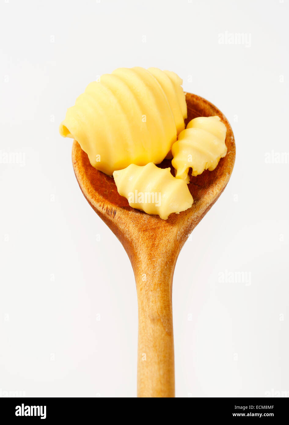 Butter curls on wooden spoon Stock Photo - Alamy