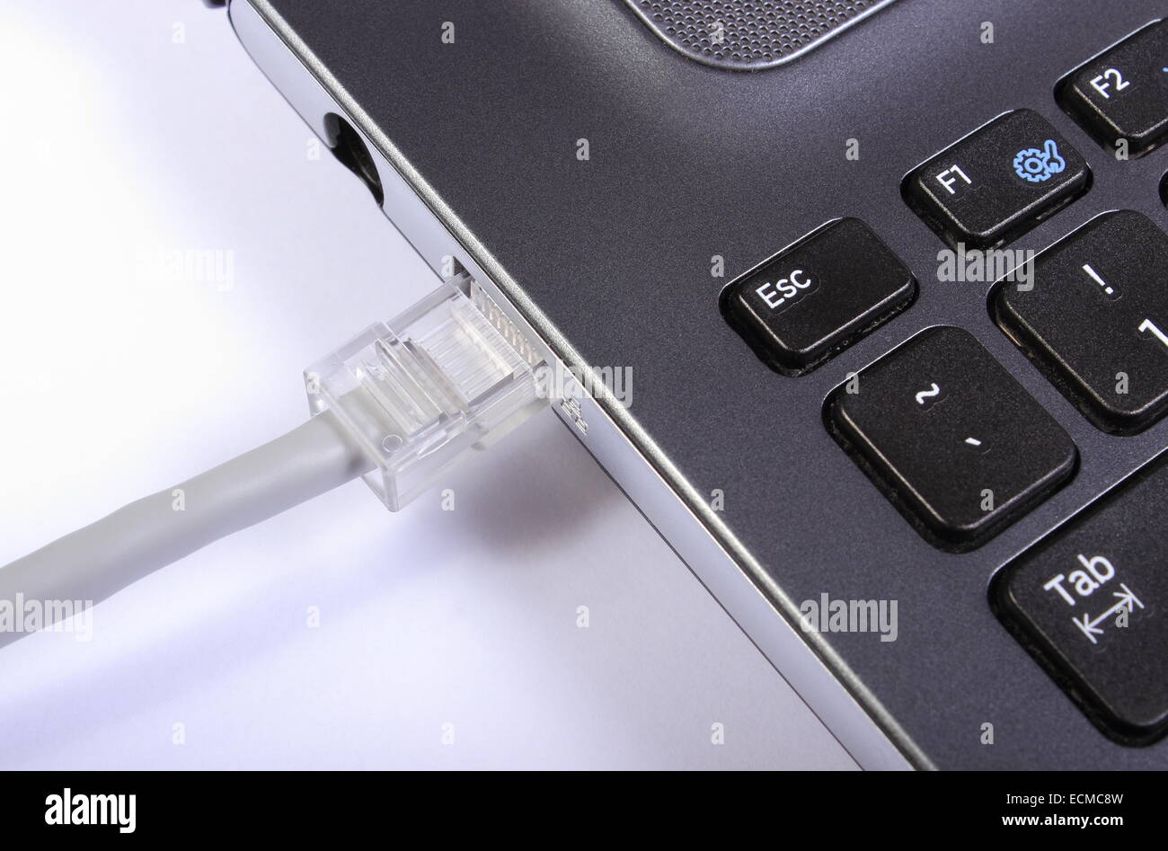 Connected patch cable to laptop, plug with internet cable and laptop ...