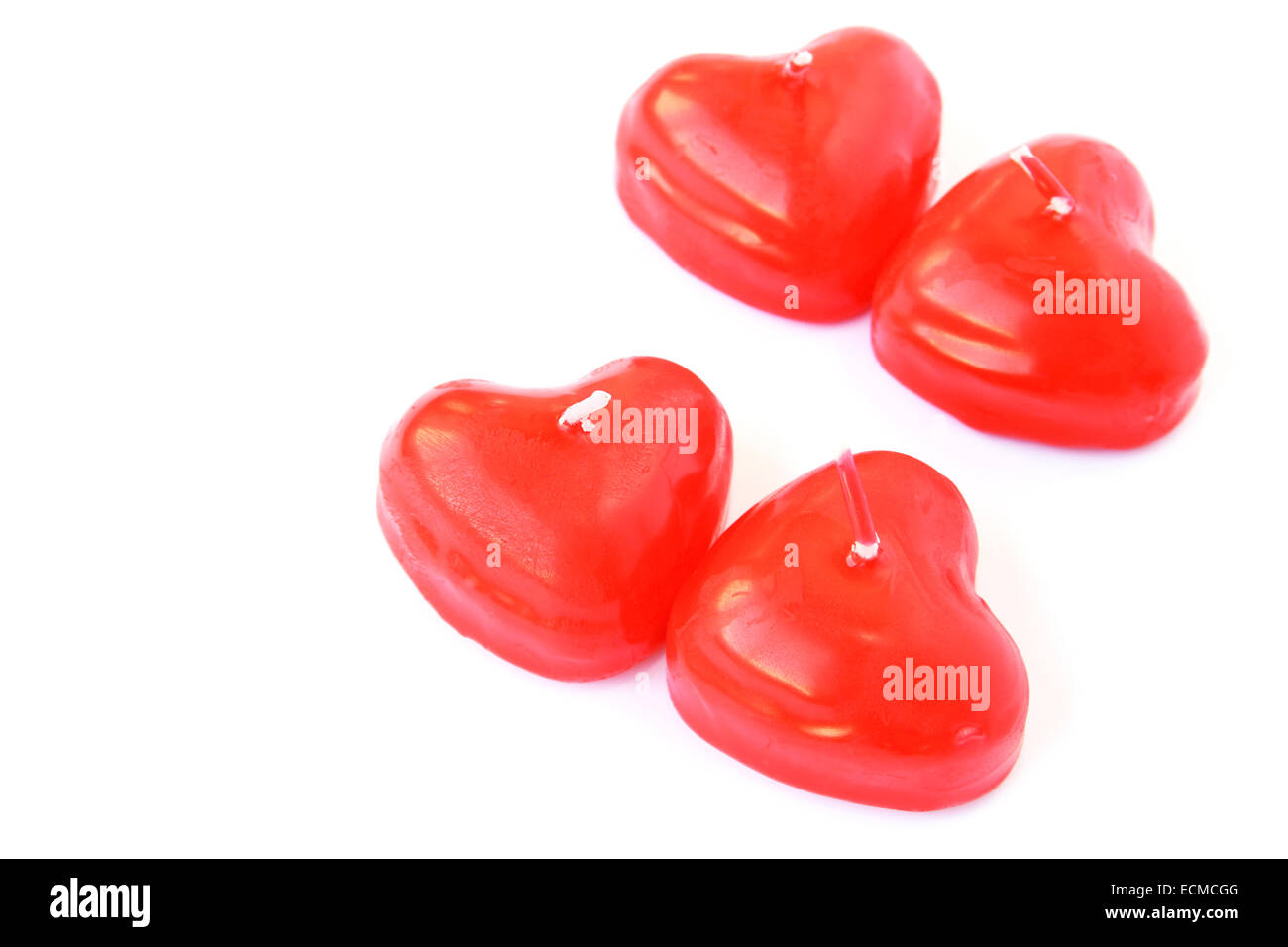 Heart shape red candles isolated on white background Stock Photo - Alamy