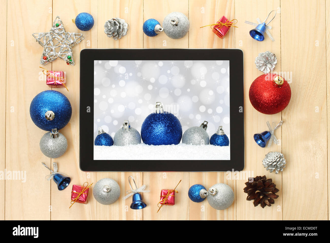 Tablet PC with Christmas decorations on wooden background Stock Photo ...