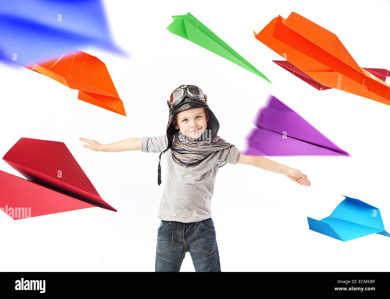 Cute little pilot among colorful paper airplanes Stock Photo - Alamy