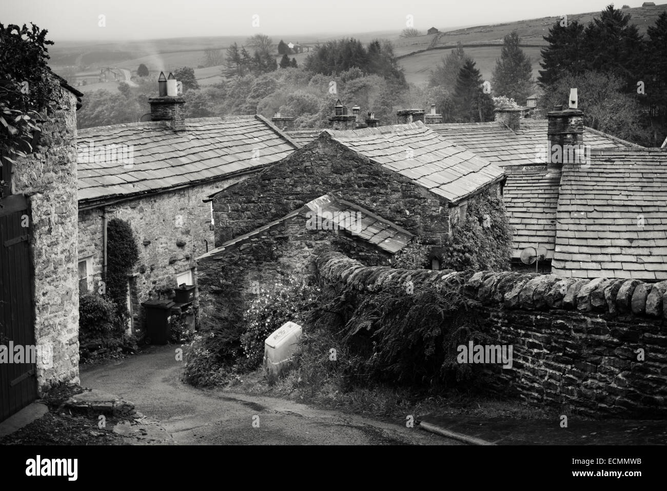 A view across the rooftops of the pretty village of Langthwaite ...