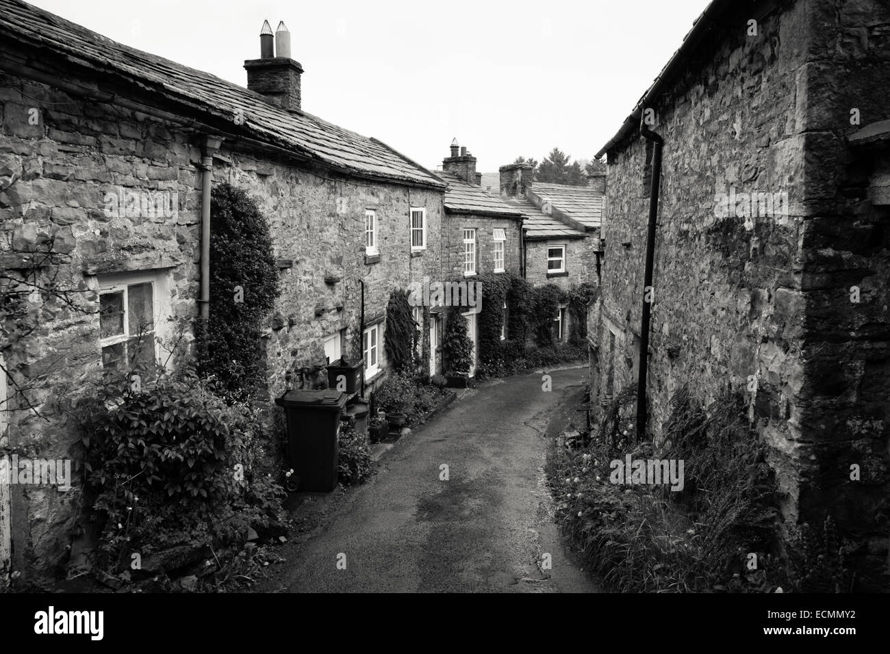A view down the curved main street in the pretty village of Langthwaite ...