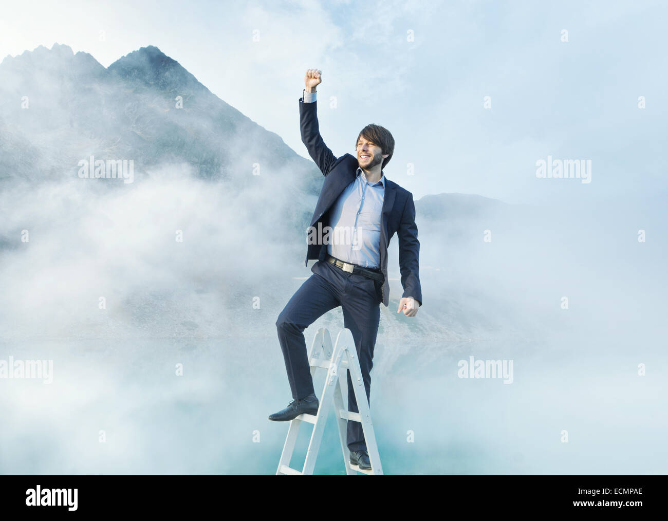 Cheerful guy on the white ladder Stock Photo - Alamy