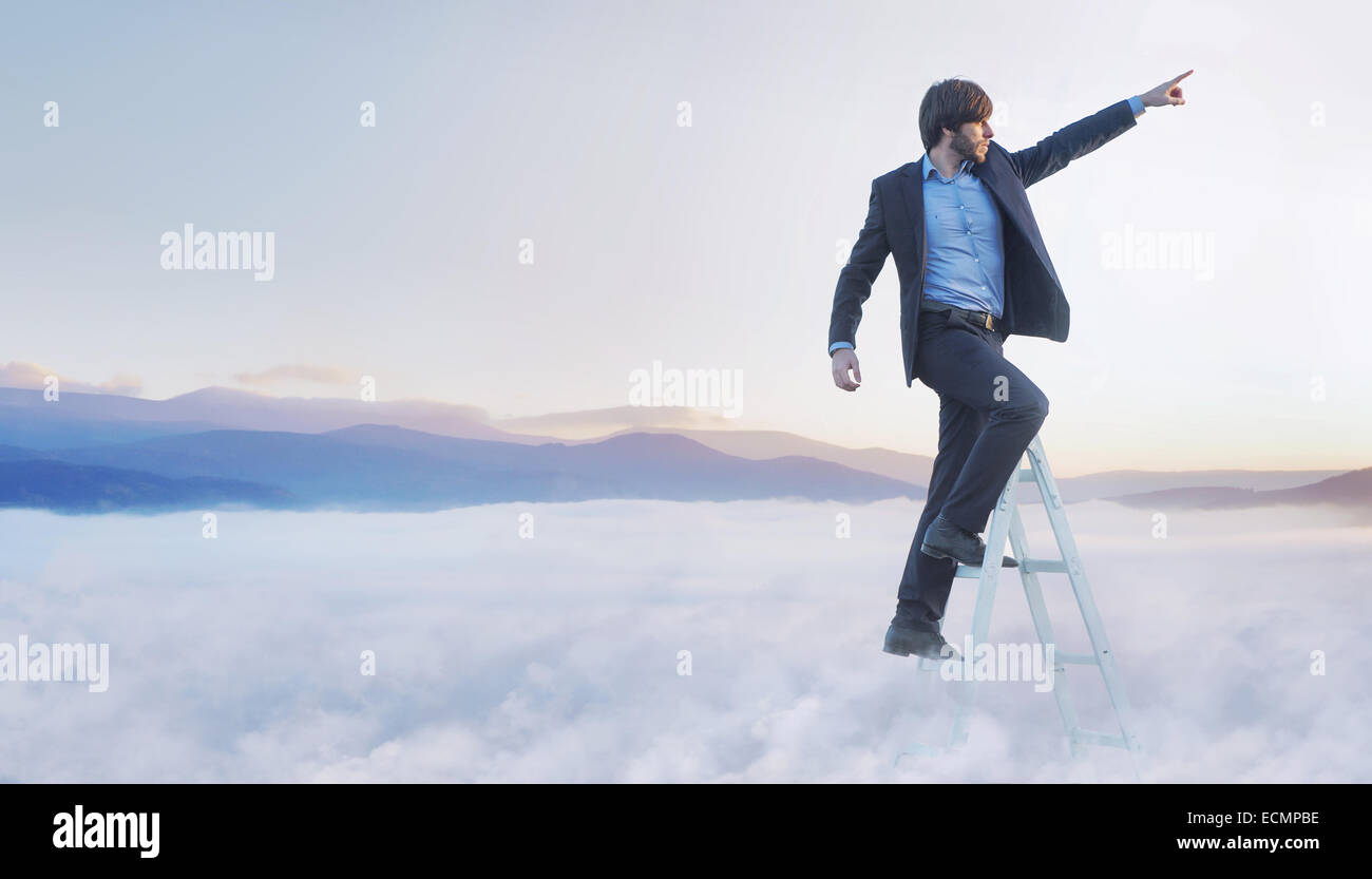 Successful businessman looking at his new aim Stock Photo - Alamy