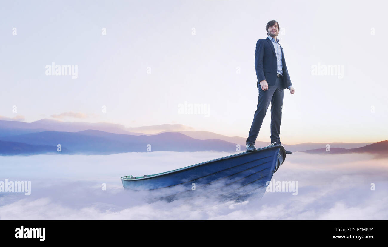 Young handsome man on small wooden boat Stock Photo - Alamy
