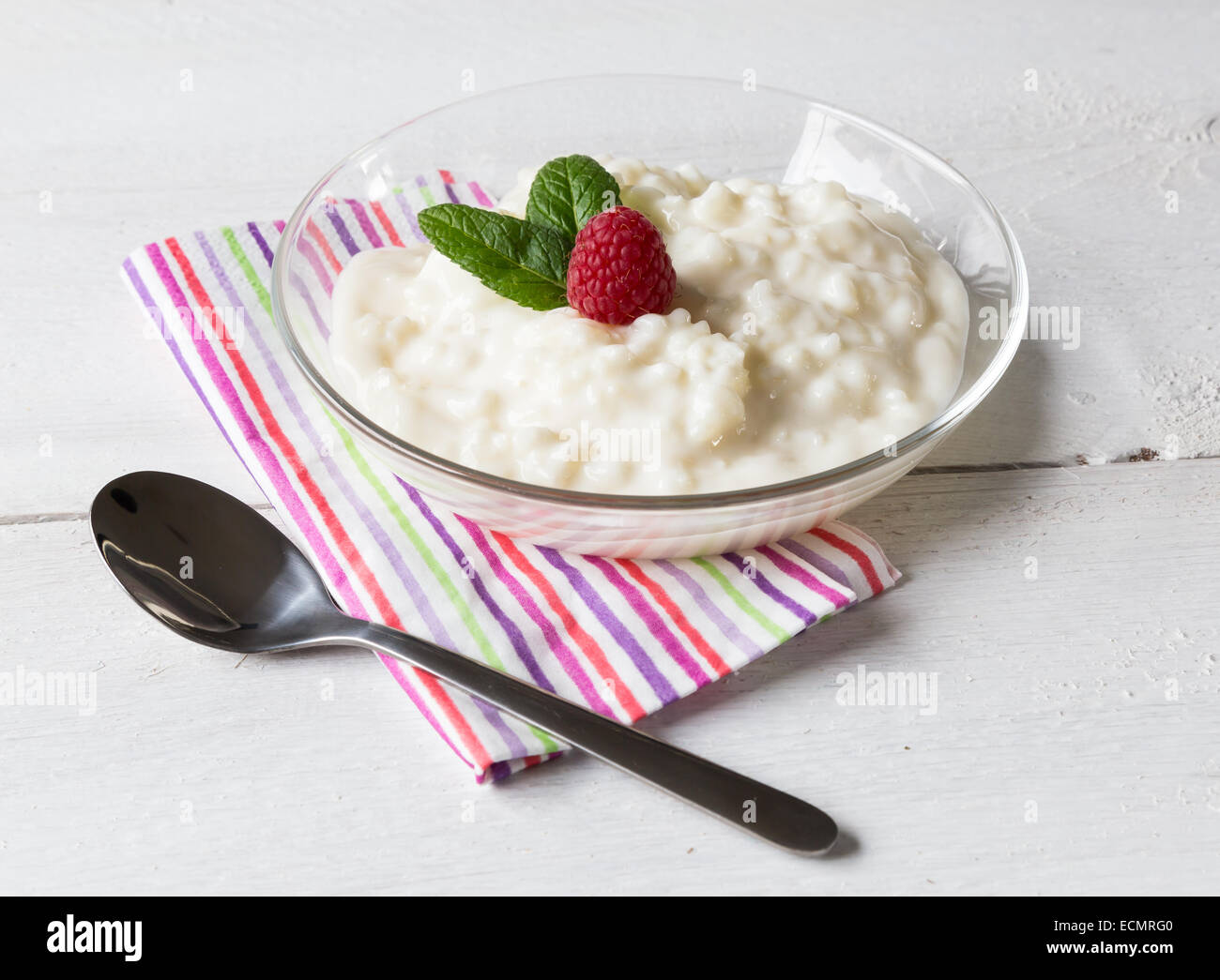 Rice pudding with mint and raspberry Stock Photo - Alamy