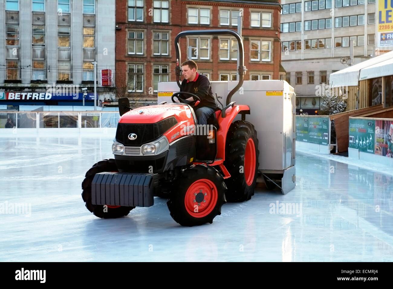 Nottingham Christmas market 2014. A worker using an Olympia ice ...