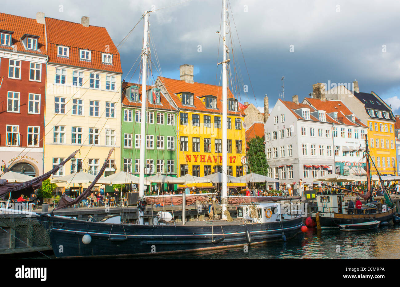 Copenhagen Denmark famous Nyhavn color homes and boats with crowds ...