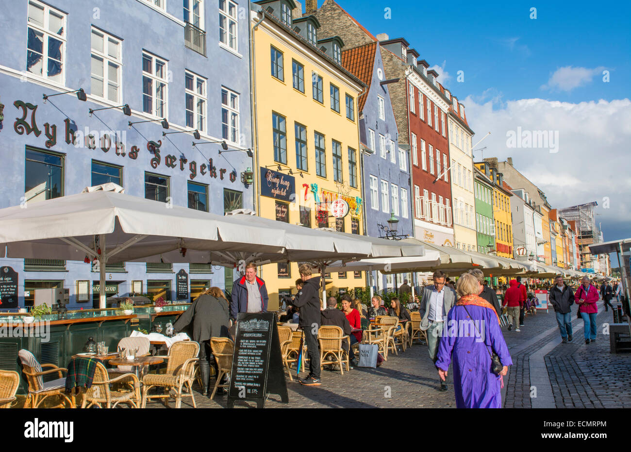 Copenhagen Denmark famous Nyhavn color homes and boats with crowds ...