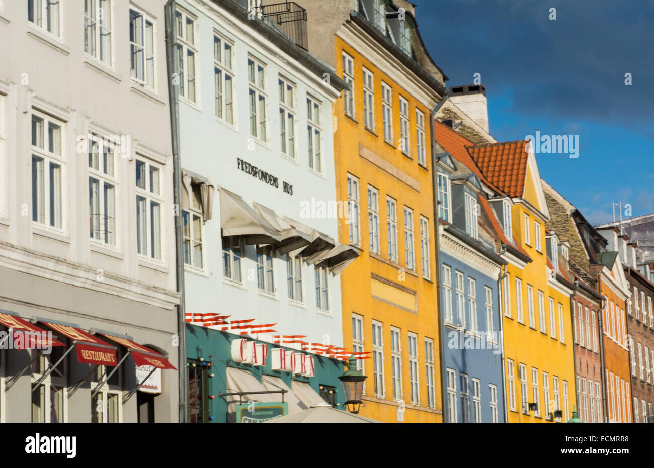 Copenhagen Denmark famous Nyhavn color homes and boats with crowds ...