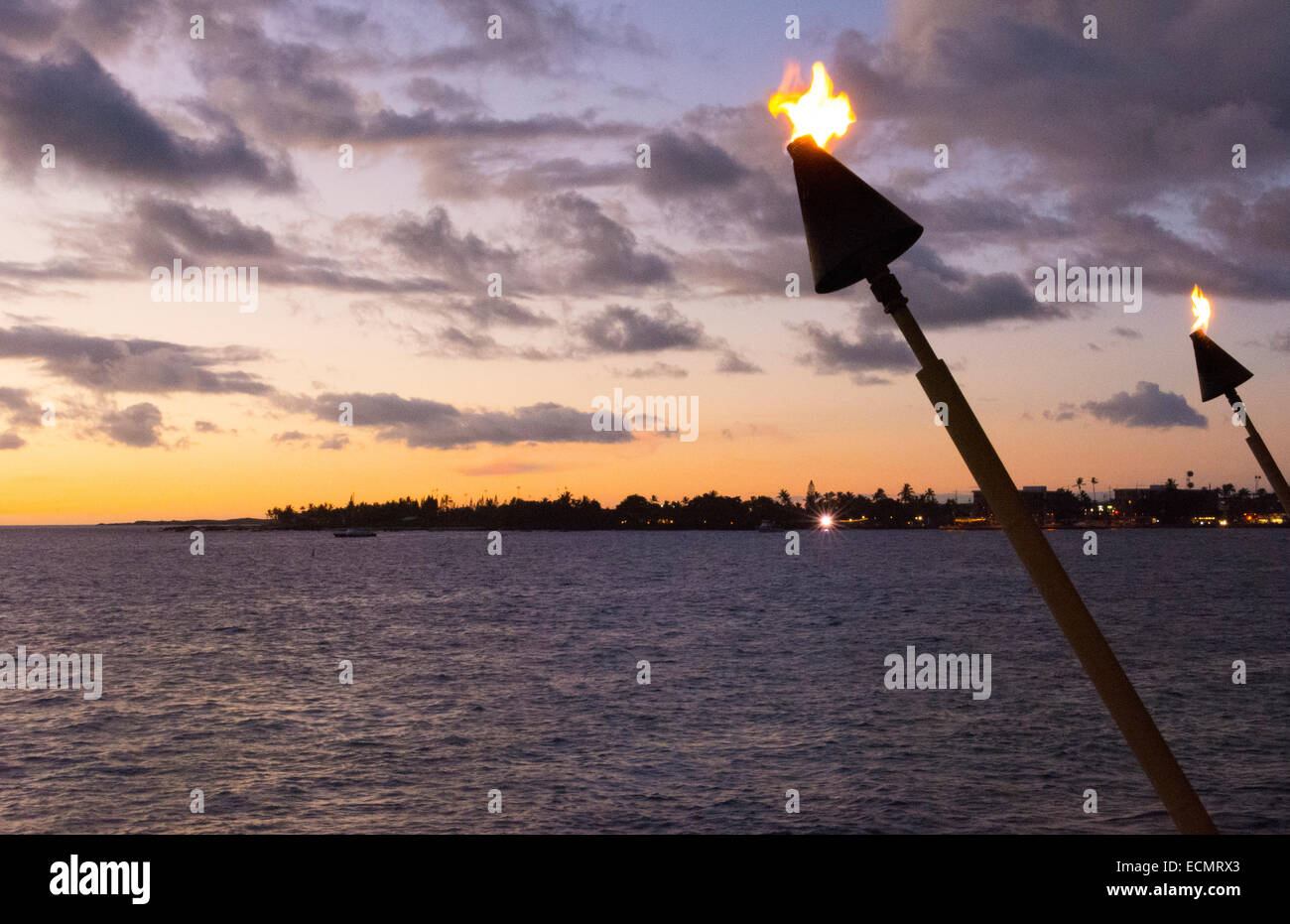 Kona Hawaii Big Island tiki fire light over Ocean at Kailua-Kona beach ...