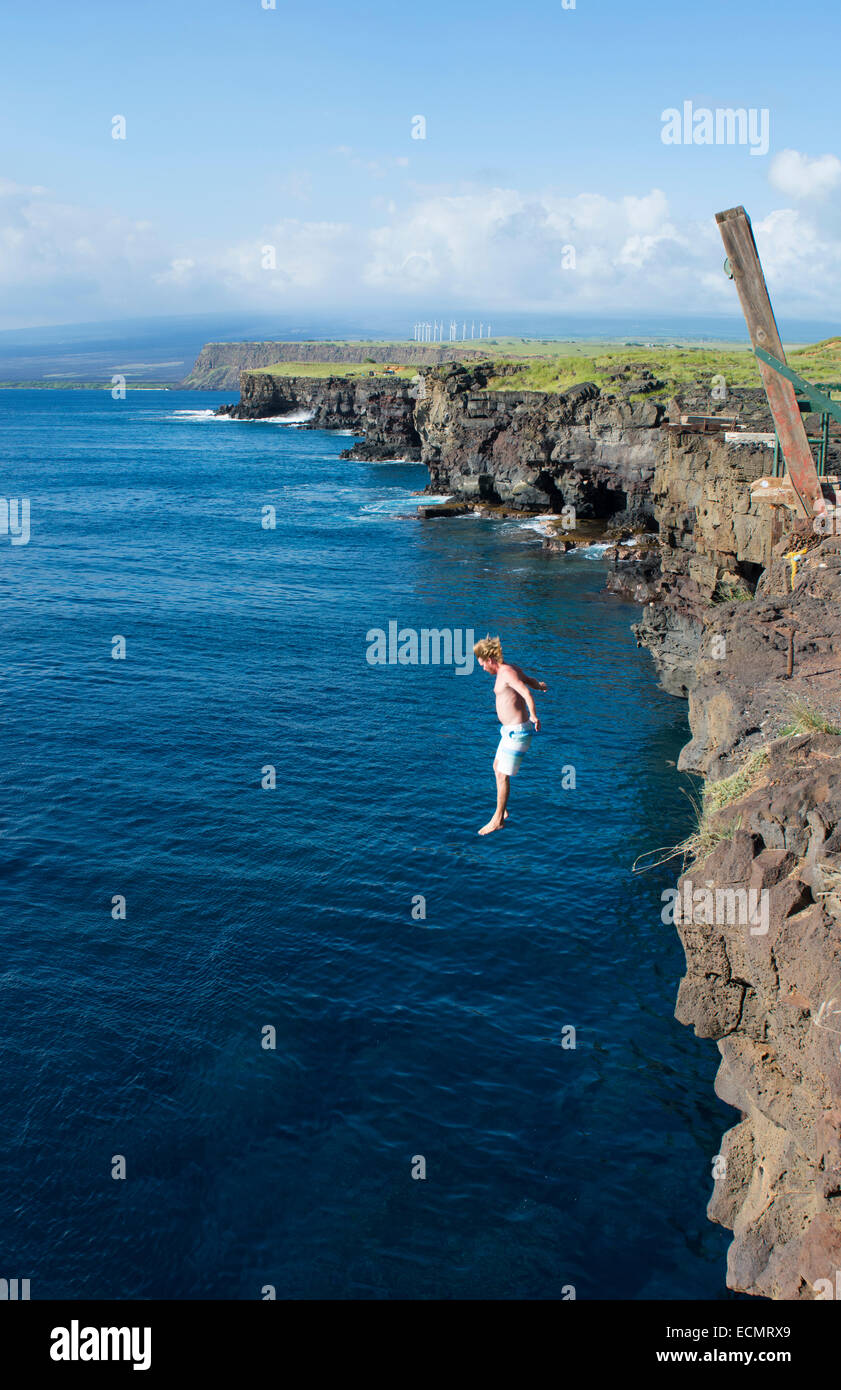 South Point Hawaii Big Island cliff pole young man diving intp water danger dangerous dive water ...